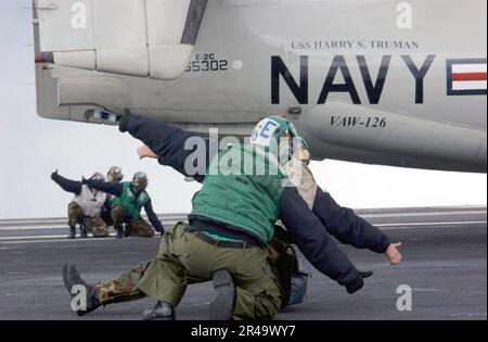 US Navy A squadron final checker holds his position while giving a ...