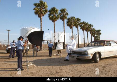 US Navy Photographer's Mate 1st Class Aviation Warfare right, instructs ...