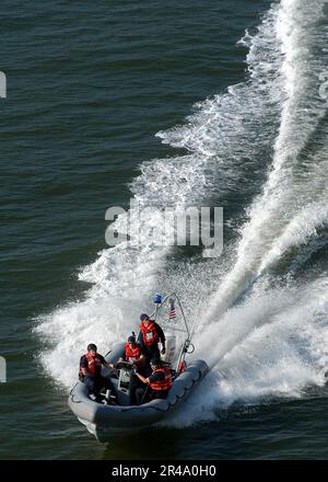 US Navy United States Coast Guard members stationed aboard the patrol ...