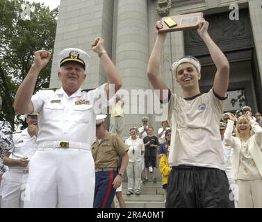 US Navy Midshipman Fourth Class Philip Johnson places a Midshipman's ...