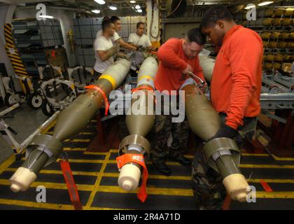 US Navy Members of G-3 bomb assembly division move a MK-82 500lb ...
