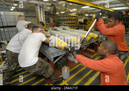 US Navy Members of G-3 bomb assembly division move a MK-82 500lb ...
