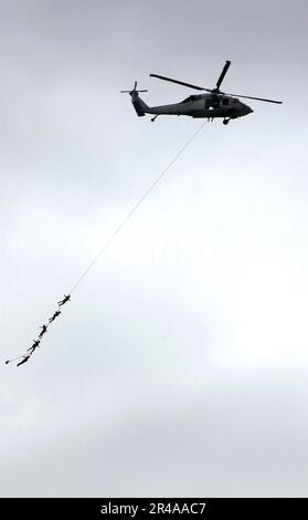 US Navy Five Sailors assigned to Explosive Ordnance Disposal Mobile ...