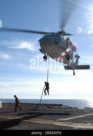 Sailors fast-rope from an MH-60S Sea Hawk helicopter. (40298624450 ...
