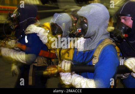 US Navy Repair Locker One Bravo's primary fire team works side-by-side ...