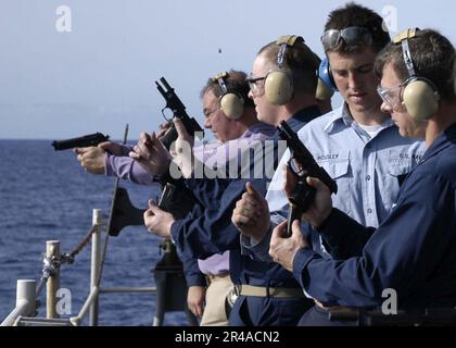 US Navy Crew members participate in a Foreign Object Damage (FOD) walk ...