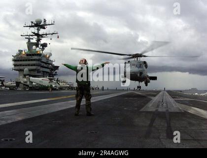 US Navy A Landing Signals Enlisted (LSE) direct an SH-60B Seahawk ...