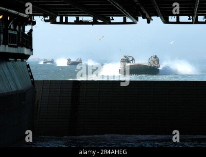 US Navy Three Landing Craft Air Cushions (LCAC) prepares to enter the ...
