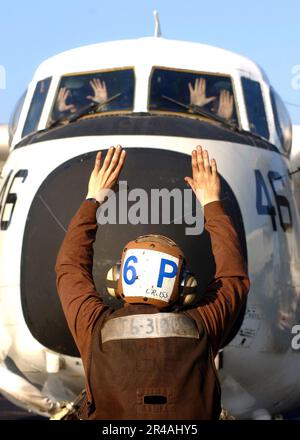 US Navy A Plane Captain gives a thumbs up to the aircraft handling crew ...