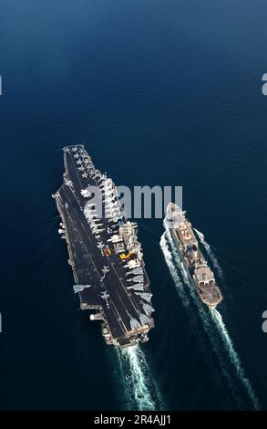USNS Saturn conducts a VERTREP with USS Harry S. Truman and USS ...