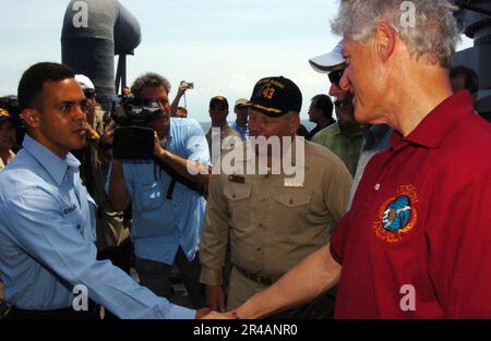 US Navy Former President William J. Clinton shakes the hand of Stock ...