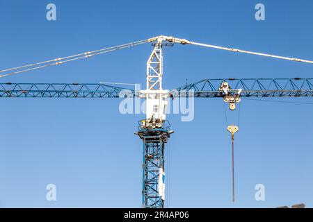 crane on a blue sky background Stock Photo - Alamy