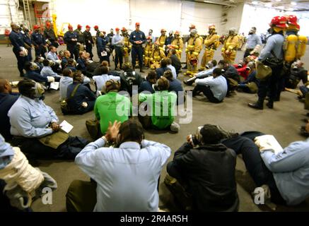 A Chief Hospital Corpsman conducts CBR gas mask training during a ...