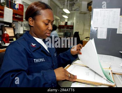 US Navy Legalman 2nd Class dons her Self-Contained Breathing Apparatus ...