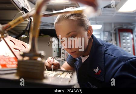 US Navy Aviation Technician 2nd class runs radar checks on an F-A-18 ...