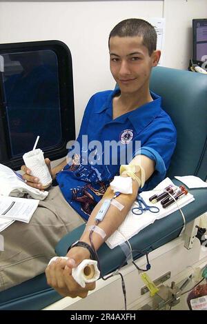 US Navy Storekeeper 3rd Class verifies aviation equipment and supplies ...