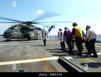 US Navy Stretcher Bearers carry a wounded Sailor through the hangar bay ...