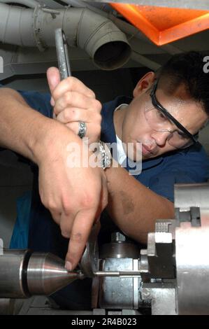 US Navy Machinery Repairman 2nd Class turns a Hossfeld pipe bender ...