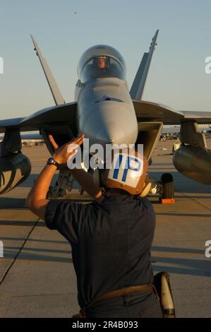 US Navy Plane Captain, Airman wipes down the in-flight refueling probe ...