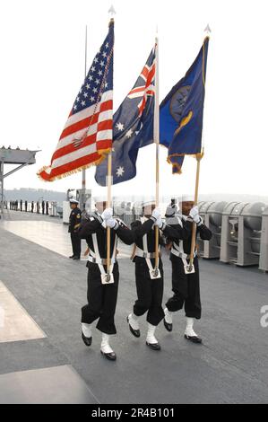 US Navy A color guard assigned to the Arleigh Burke-class guided ...