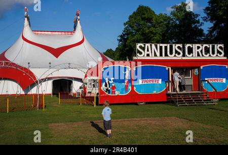 A small boy stands excited outside a Big Circus tent as he waits to ...