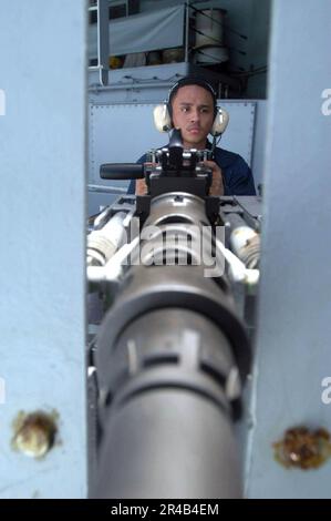 Airman mans a .50 caliber machine gun aboard USS New York Stock Photo ...
