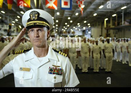 US Navy Rear Adm. Jamie Kelly, Commander, Carrier Group Five, gives a ...