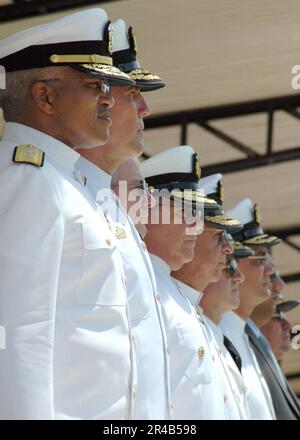US Navy Rear Adm. P. D. Smith displays a plaque presented in honor of ...