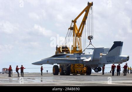 Crash and Salvage personnel stabilize a training airframe on the flight ...