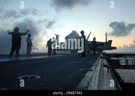 US Navy An aircraft director directs an aircraft to the catapult ...