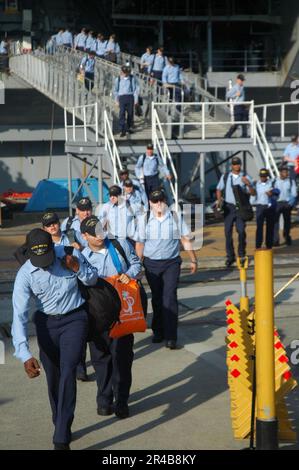 Sailors depart conventionally powered aircraft carrier USS Kitty Hawk ...