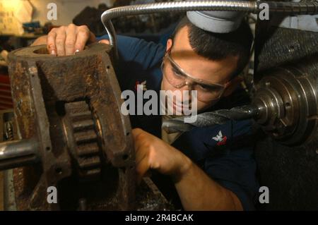 US Navy Machinery Repairman 2nd Class turns a Hossfeld pipe bender ...