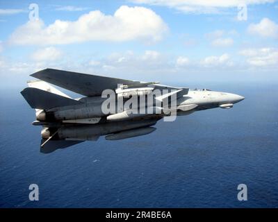 US Navy An F-14D Tomcat banks with its tailhook lowered in preparation ...