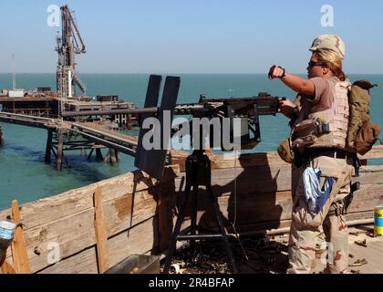 US Navy A member of Mobile Security Squadron Seven mans an M60 7.62mm ...