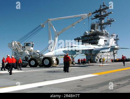 Crash and Salvage personnel stabilize a training airframe on the flight ...