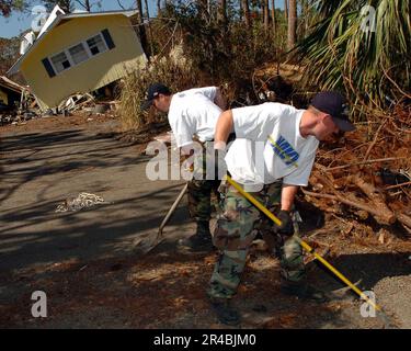 US Navy Machinist Mate Fireman (MMFN) Brian Zitt checks a torpedo tube ...