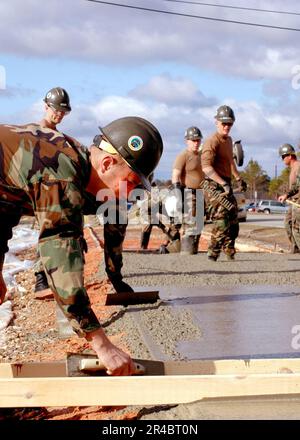 US Navy Construction Electrician assigned to Naval Mobile Construction ...