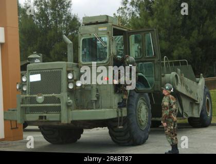 US Navy Equipment Operator 3rd Class assigned to Naval Mobile ...