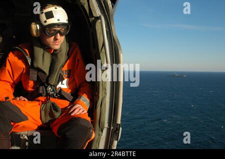 US Navy Intelligence Specialist 3rd Class looks through the big eyes ...