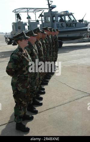 US Navy Navy Coastal Warfare Squadron Four (NCWS-4) Sailors stand at ...