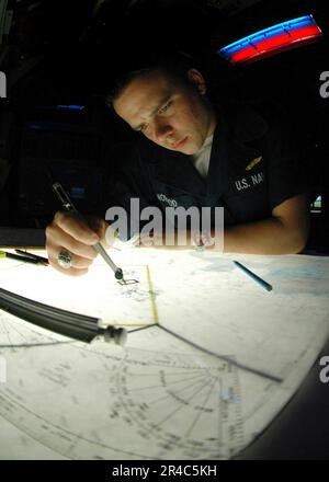 An Aviation Warfare Systems Operator plots maps in the Anti-Submarine ...