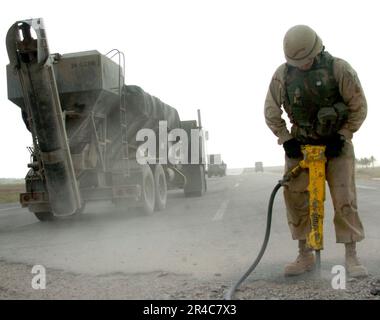 US Navy Builder 3rd Class assigned to Naval Mobile Construction ...