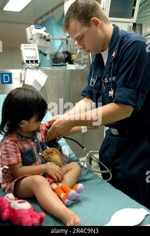U.S. Navy hospital corpsman 3rd class Gavin Knowles, right, and ...