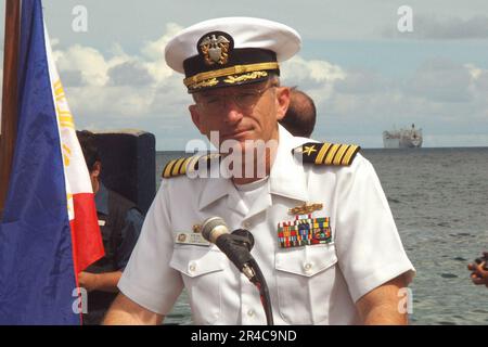 US Navy Commander, Amphibious Squadron Seven, Capt. speaks to guests ...