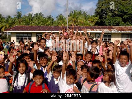 Local children wave goodbye to medical staff from Military Sealift ...