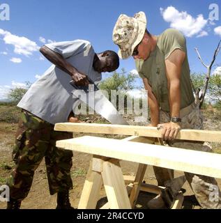 US Navy Kenyan Army Construction Engineer, leads U.S. Marines through ...