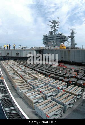 US Navy Ammunition is transferred from the flight deck to the ship's ...