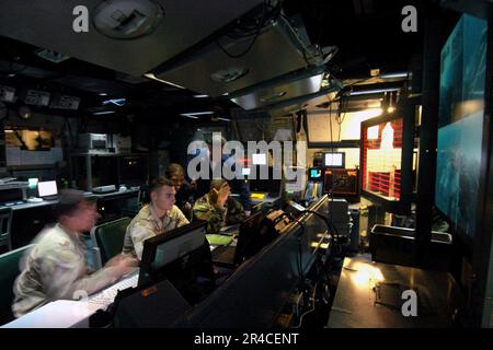 US Navy Air Traffic Controllers man the Carrier Air Traffic Control ...
