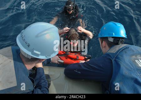 US Navy Aviation Ordnanceman prepare MK-76 practice bombs to be issued ...