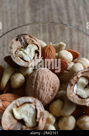 Different types of nuts in the nutshell Stock Photo - Alamy